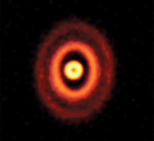 Triple star system features mis-aligned planet-forming dust rings ...